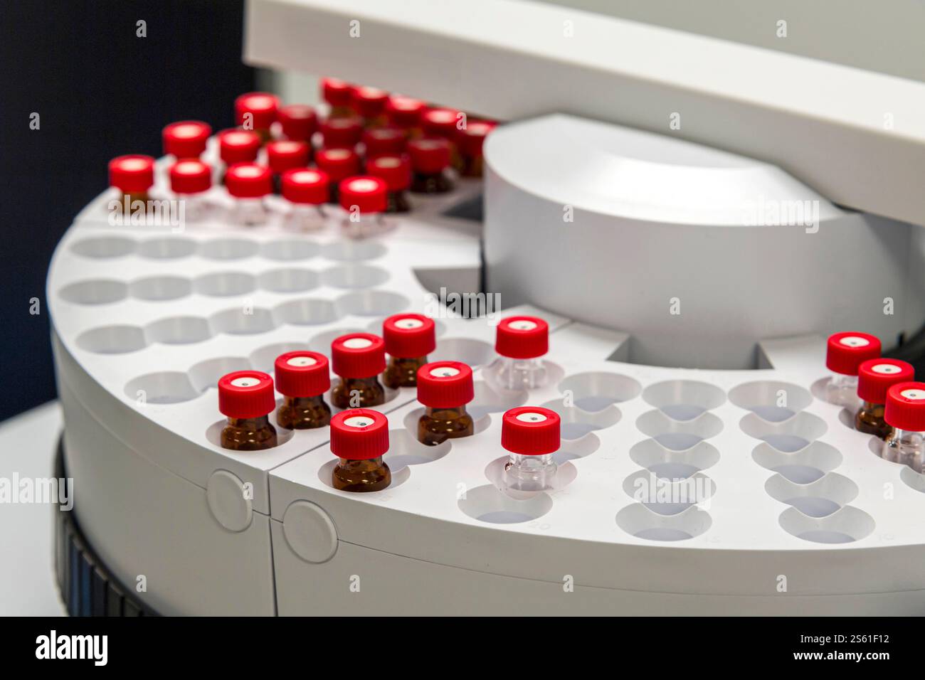 Vials in automated scientific testing equipment, USA Stock Photo - Alamy