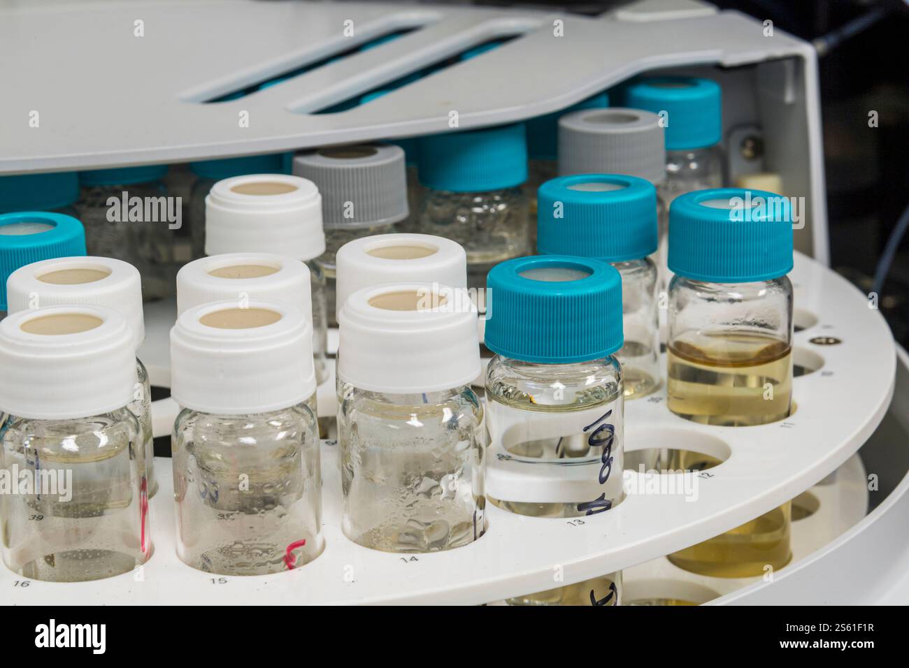 Vials in automated scientific testing equipment, USA Stock Photo - Alamy