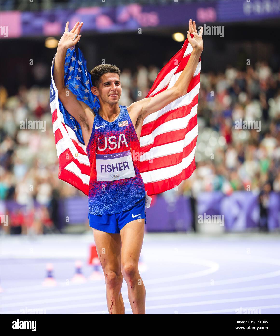 Grant Fisher celebrating her medal with her country's flag at the Paris ...