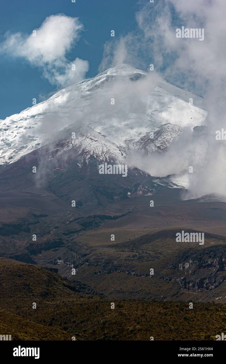 The majestic Cotopaxi volcano rises above the Andean landscape, with ...
