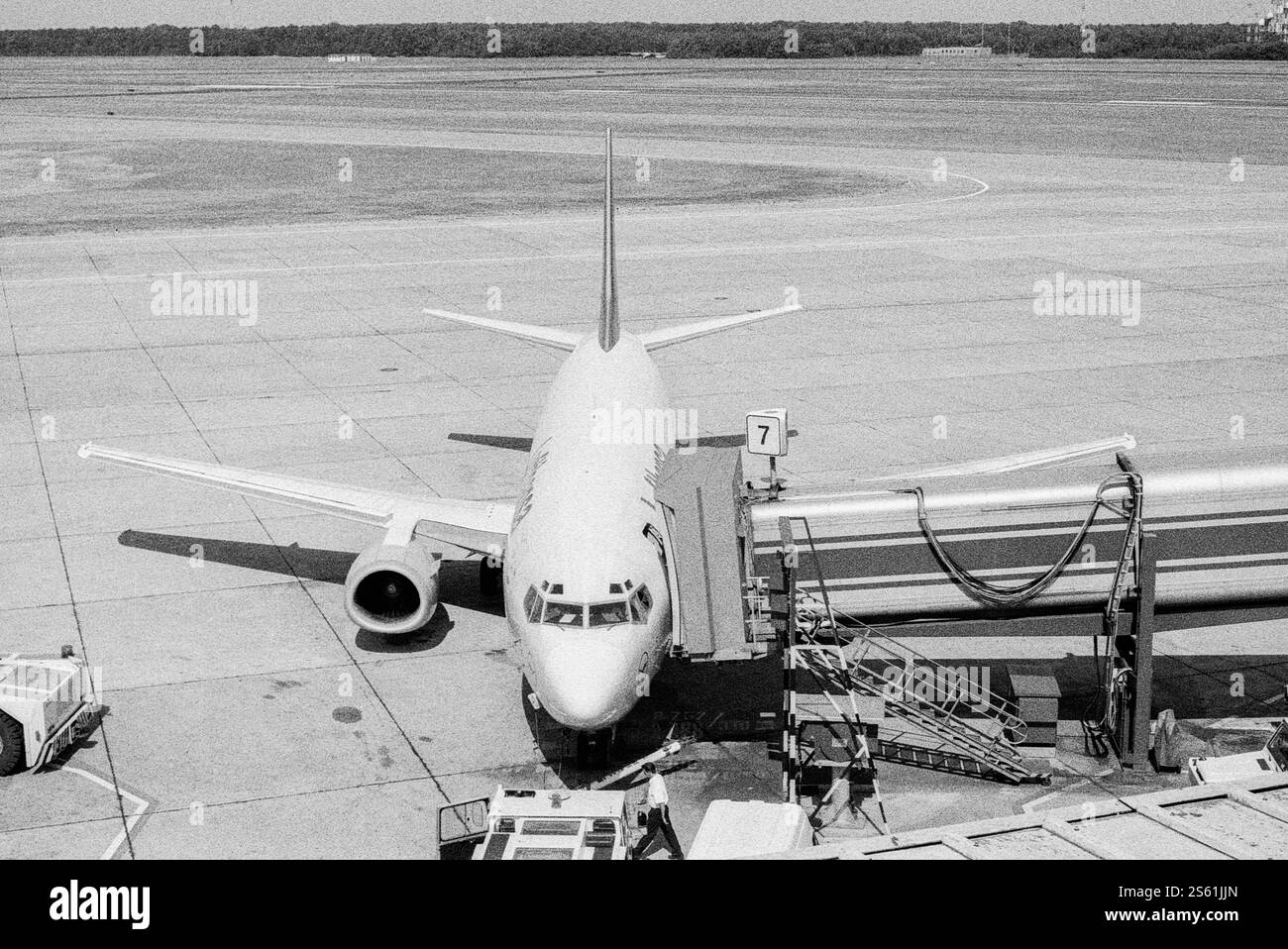 A Passenger Jet Airplane Embarking Passengers at a Tegel Airport Gate ...