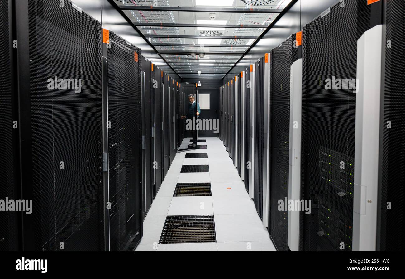 PRODUCTION - 19 November 2024, Bavaria, Nuremberg: Server cabinets are located in the data ...
