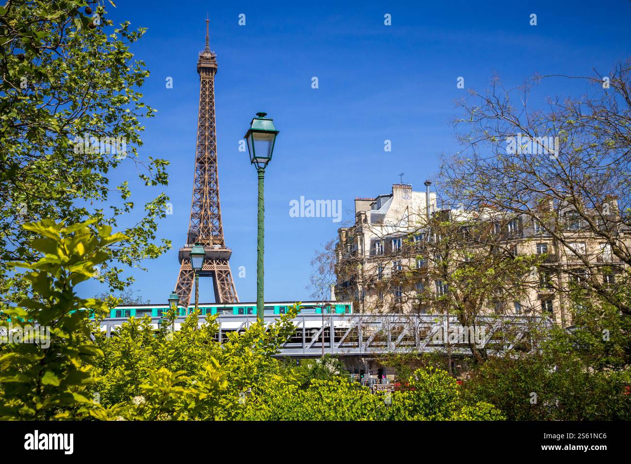 Eiffel Tower and subway on a bridge in Paris, France. Eiffel Tower and ...