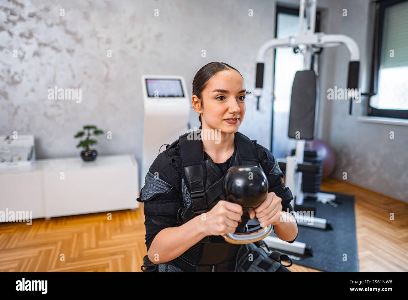 Electro muscle stimulation training at a gym Stock Photo - Alamy