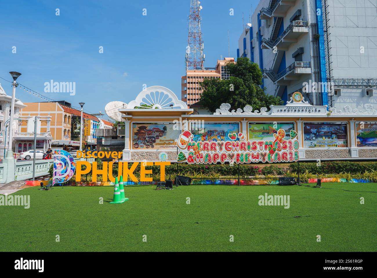 Discover Phuket Sign with Festive Decorations and Urban Backdrop Stock ...