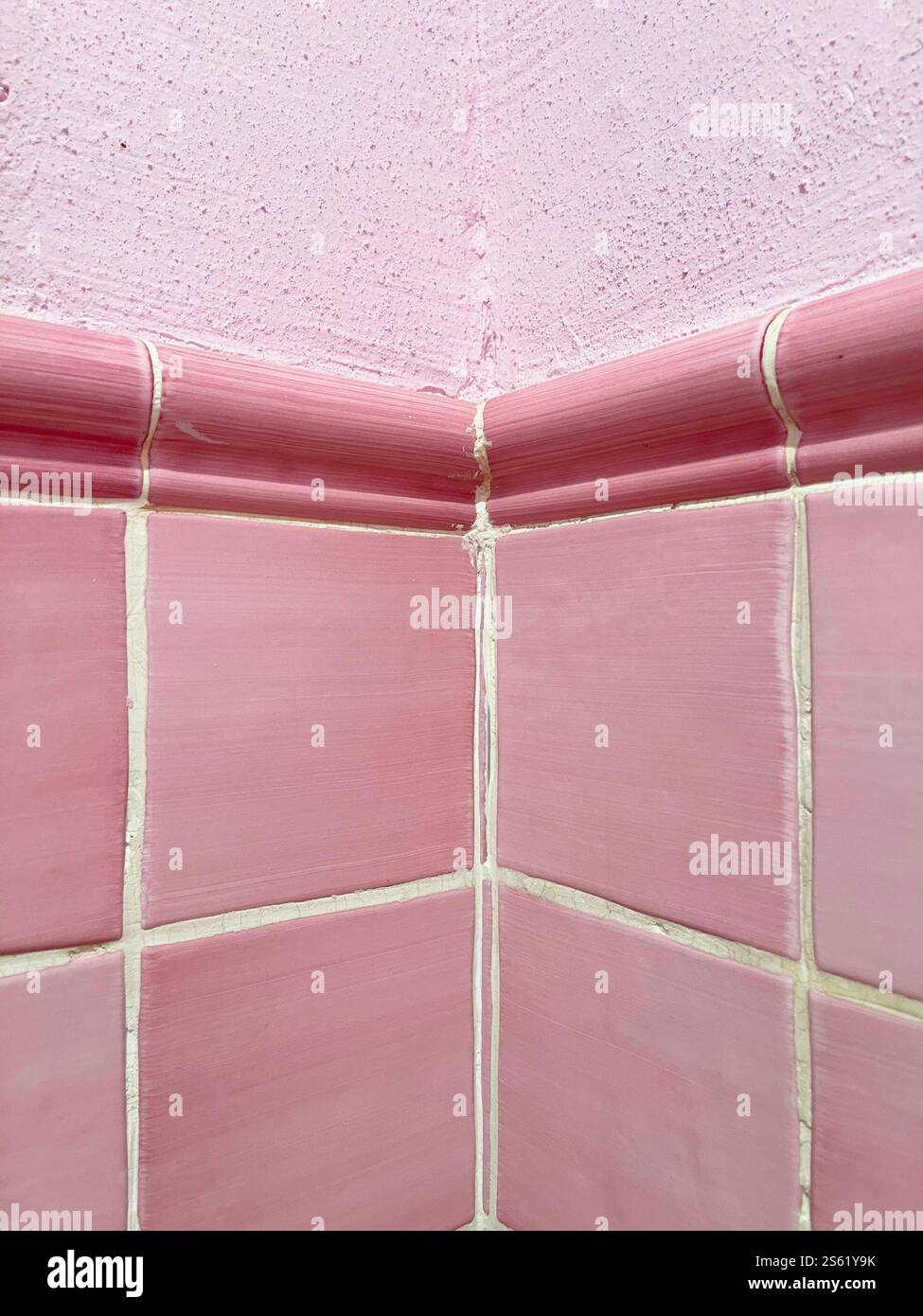 Wall corner in pink color Stock Photo - Alamy