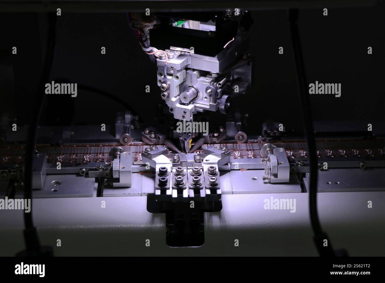A machine works at a chip maker in Binzhou city in east China's ...