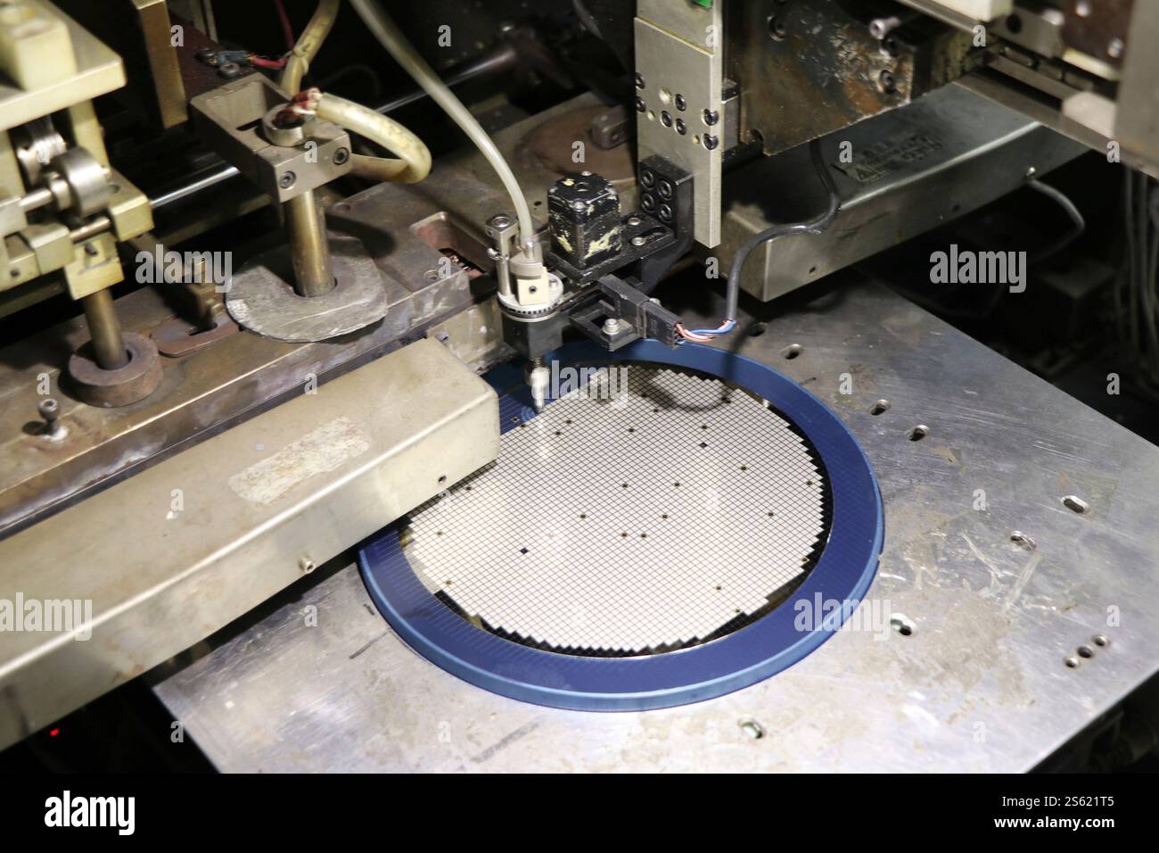 A machine works at a chip maker in Binzhou city in east China's ...