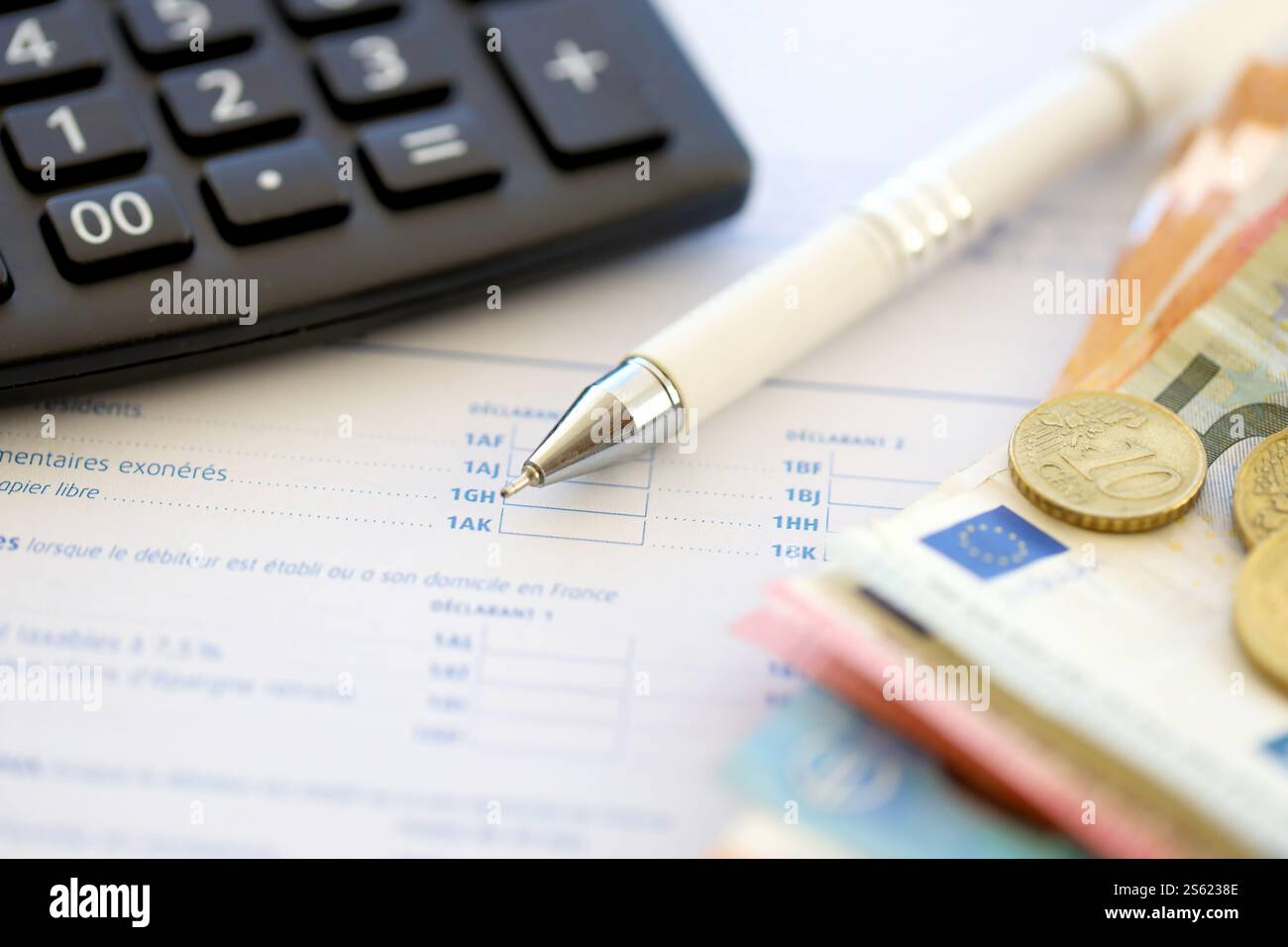 Filling french tax form process with calculator hi-res stock ...