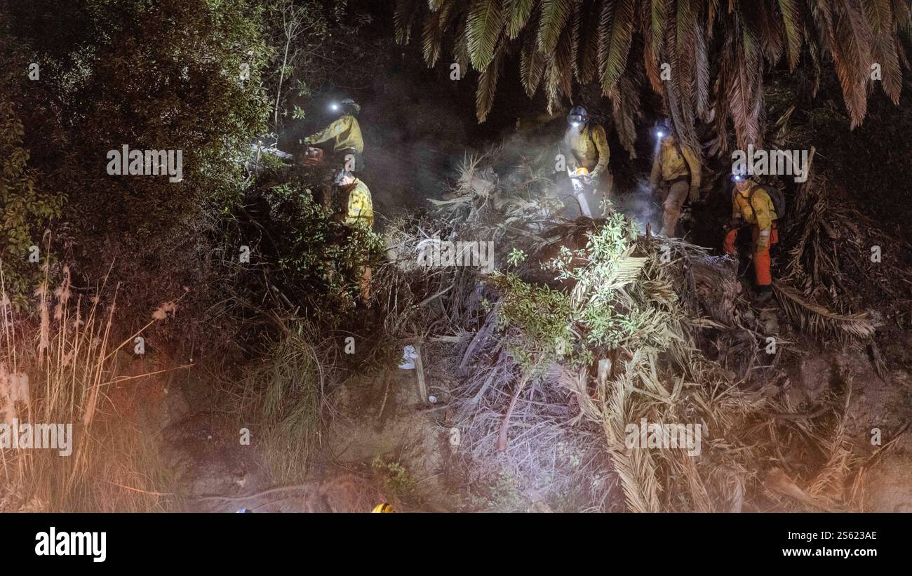 Pacific Palisades, California, USA. 15th Jan, 2025. Cal Fire crew work ...