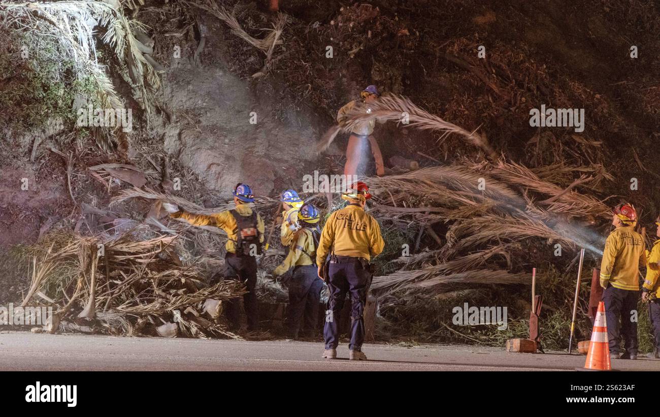 Pacific Palisades, California, USA. 15th Jan, 2025. Cal Fire crew work ...