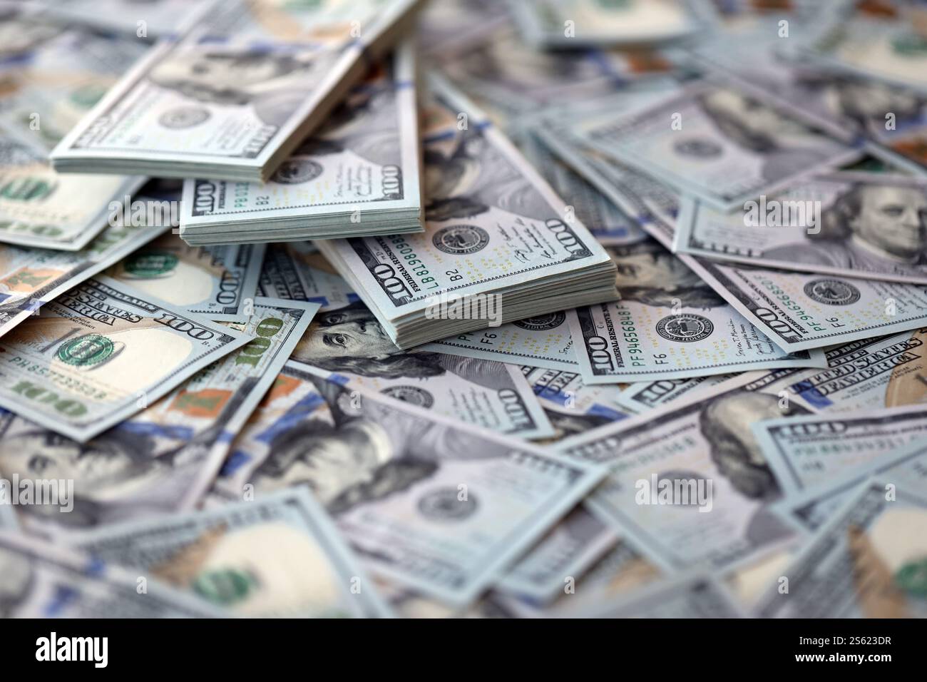 Very big amount of US hundred dollar bills close up. Huge quantity of ...