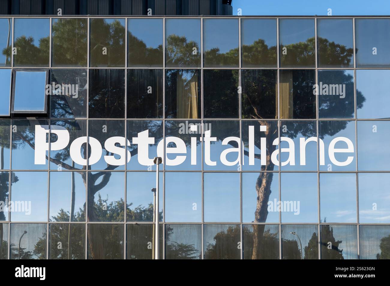 Poste Italiane (Italian Post) logo sign on the glass facade of the ...