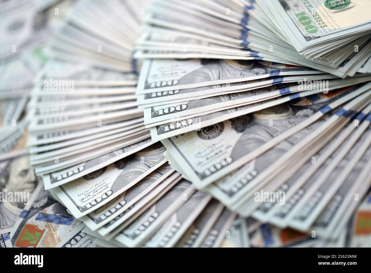 Very big amount of US hundred dollar bills close up. Huge quantity of ...