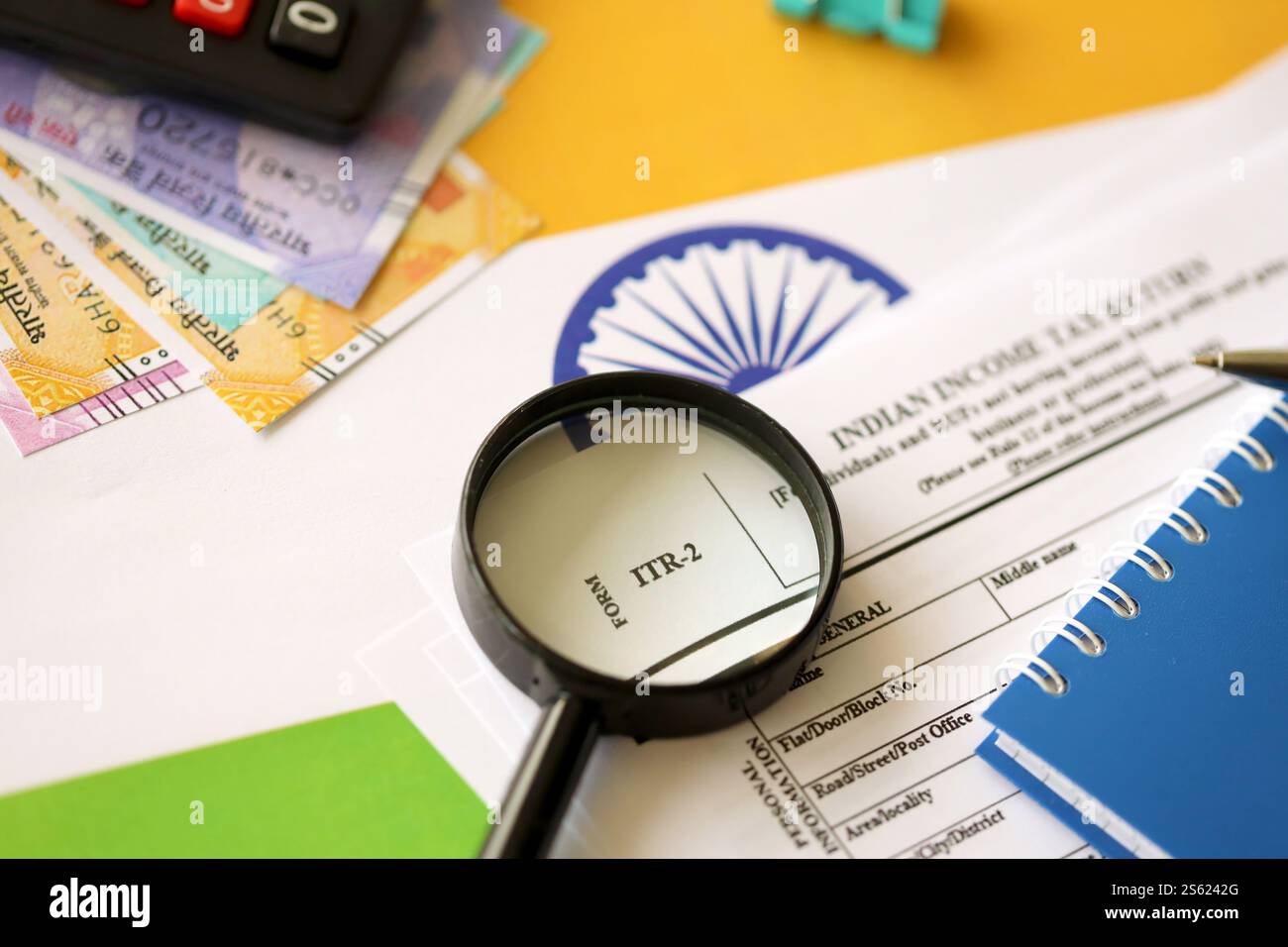 Indian income tax return blank form with pen and indian rupees bills on ...
