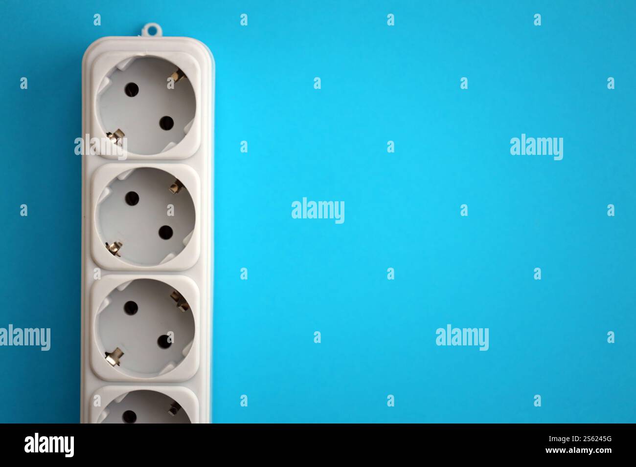 White electrical multi plug extender with european socket on bright ...