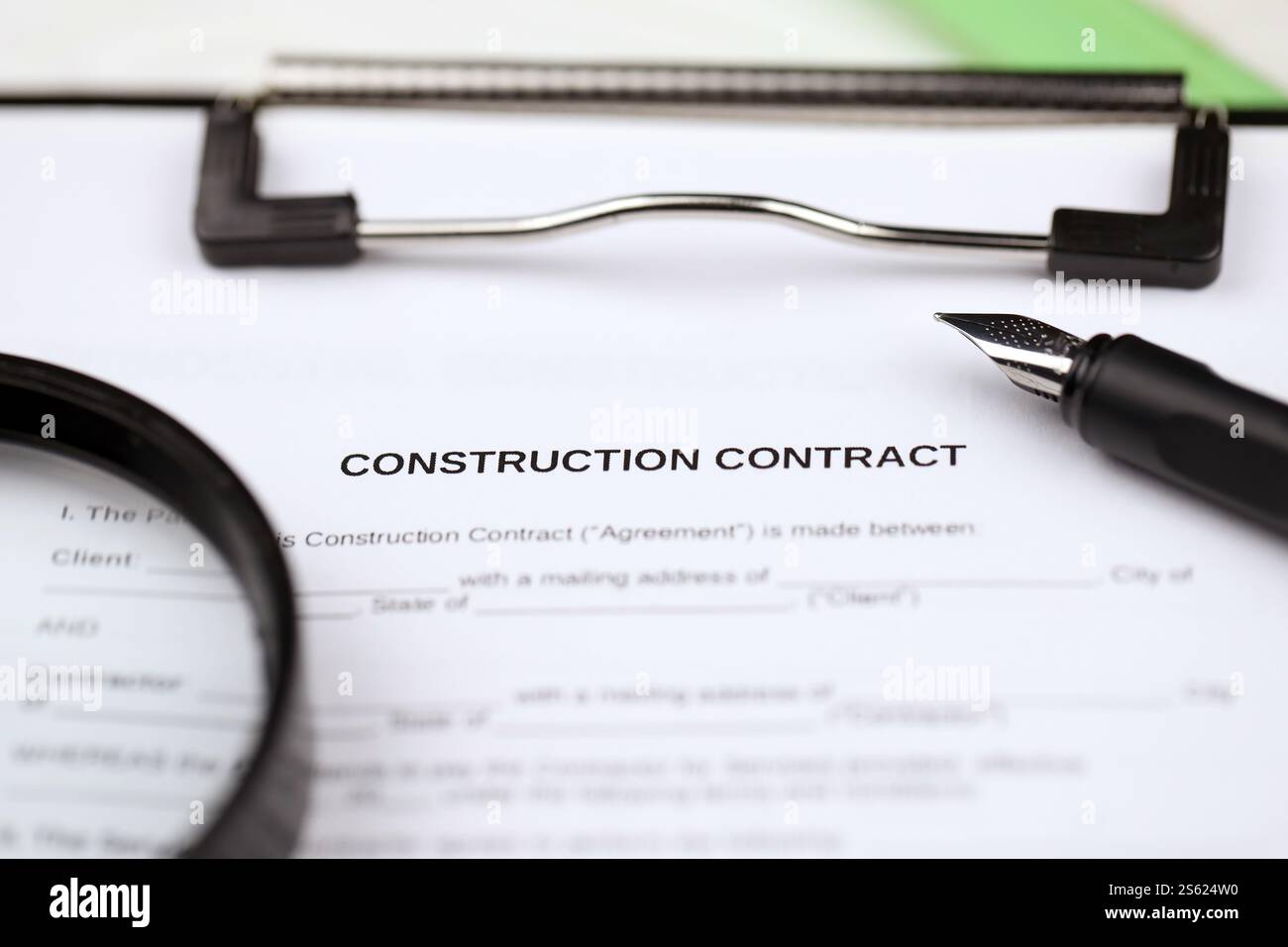Construction contract form on A4 tablet lies on office table with pen ...