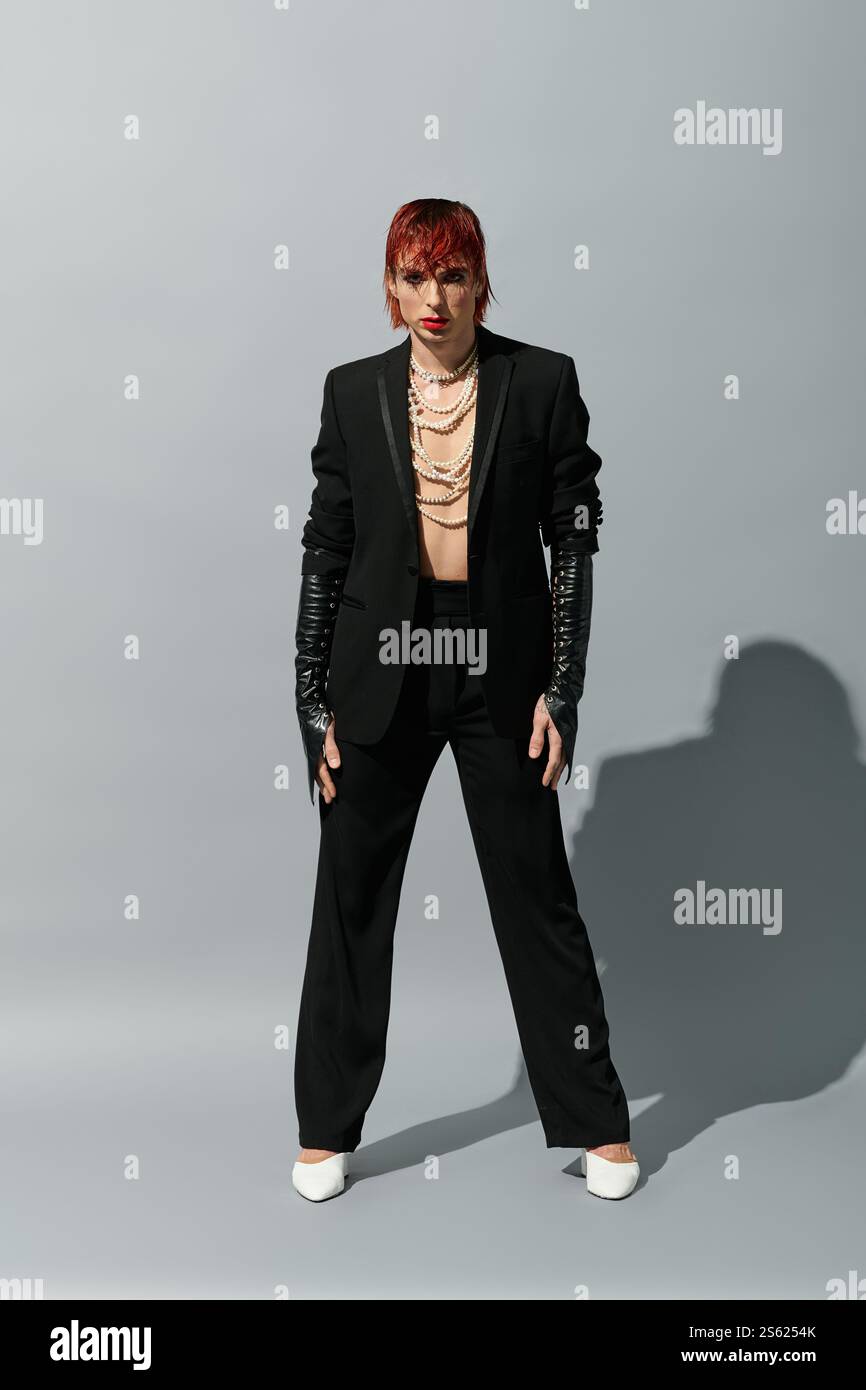 A unique young man showcases a daring outfit with flair, exuding ...