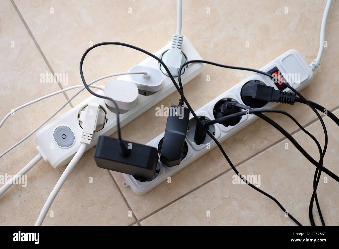Overloaded power boards. Power strips with different electrical plugs ...