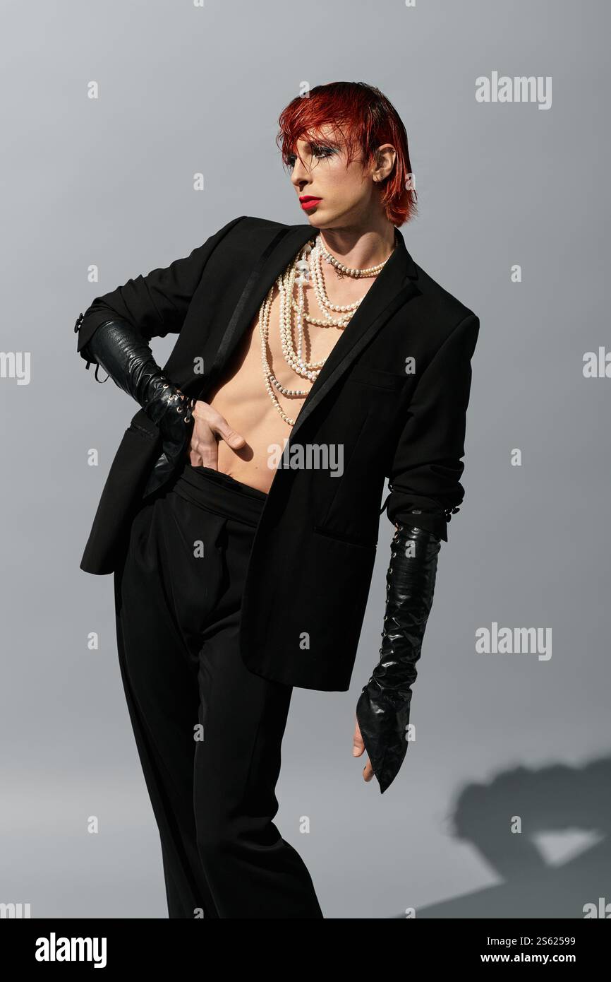 Striking young man showcases fashion forward style with a bold pose and ...