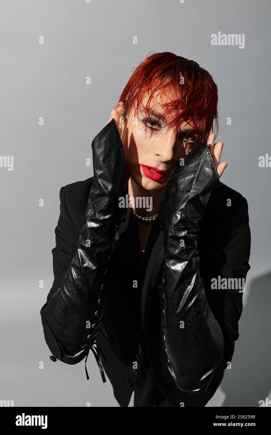 A handsome young man showcases his unique style while posing ...