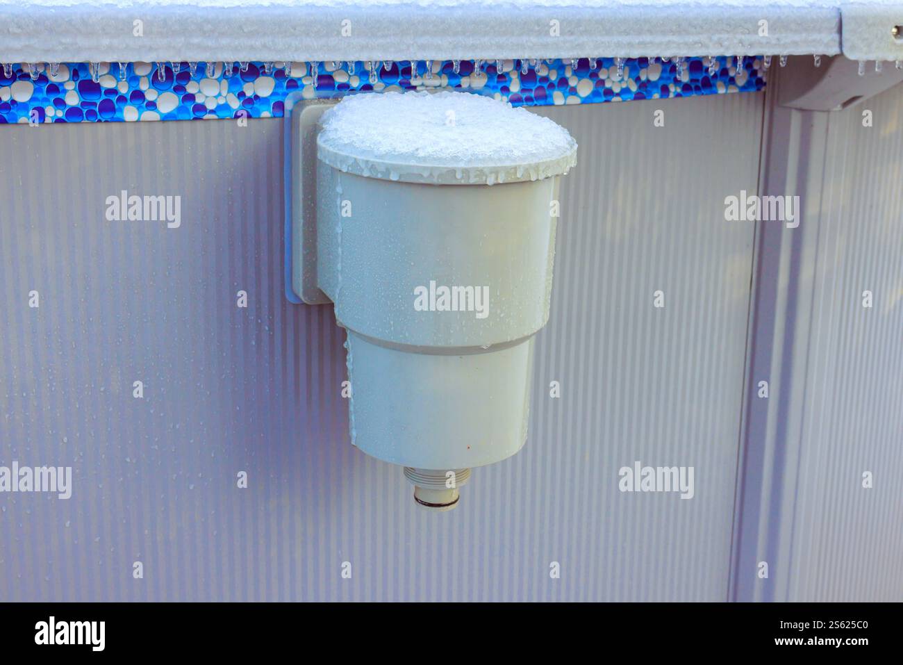 Frost builds up on pool skimmer attached to an above ground pool during ...