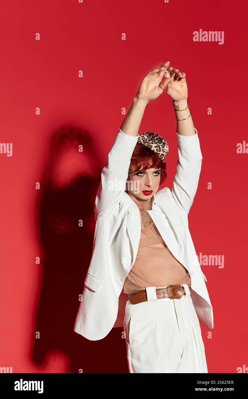 A young man in bold colors showcases striking features and a dynamic ...