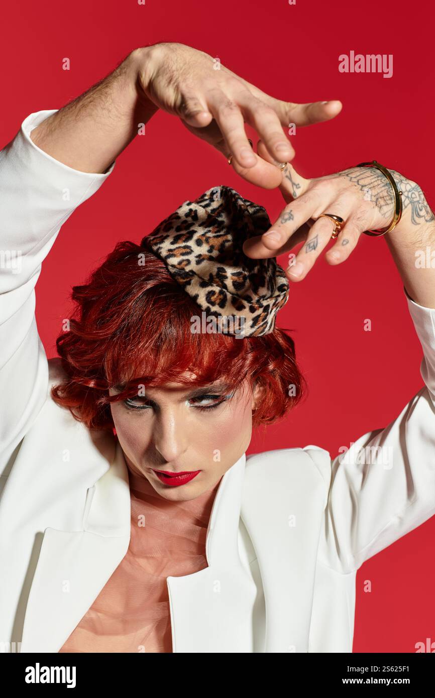 A young man showcases his distinctive fashion sense with bold gestures ...