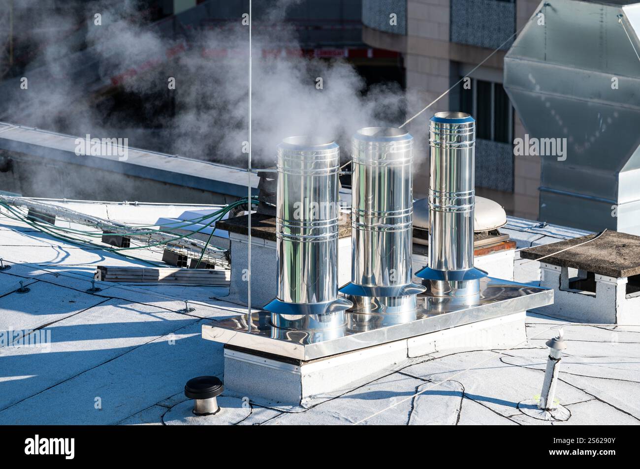 Smoking metal renovated chimney, Brussels city center, Belgium, JAN 13 ...