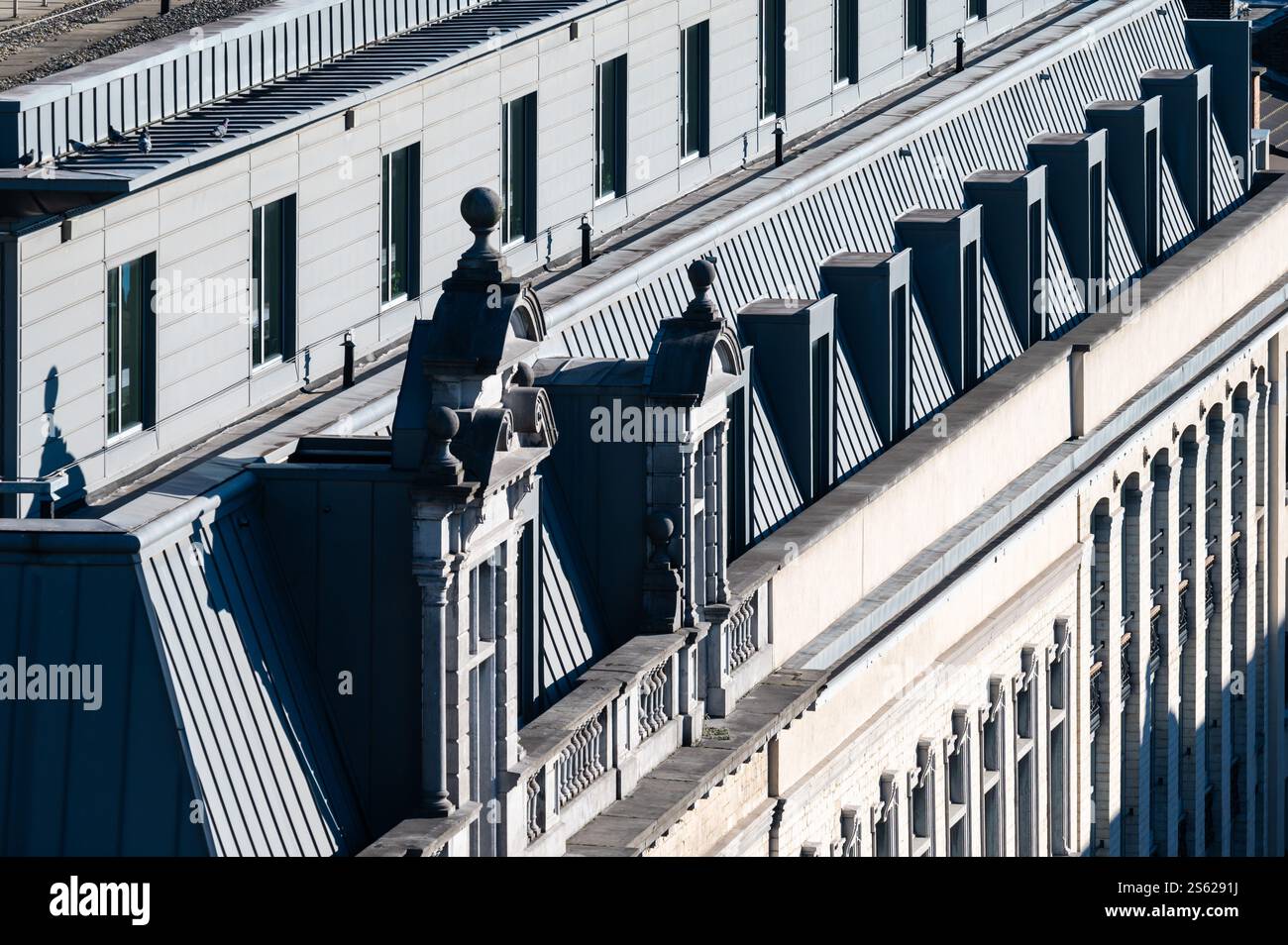 Decorated dormers in a row, detail of a classical rooftop, high angle ...