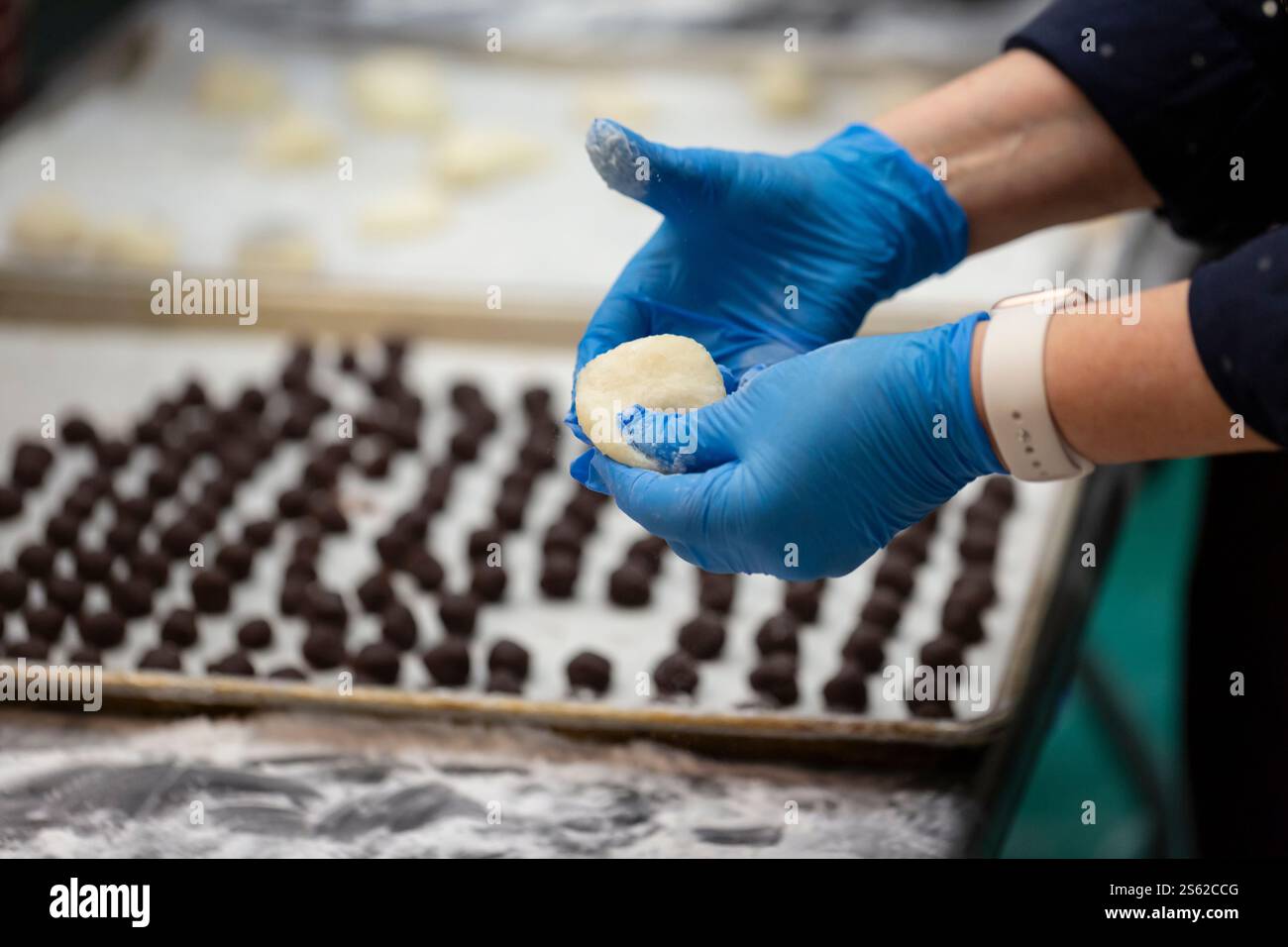 A volunteer prepares mochi at the Mochi Tsuki festival on Bainbridge ...