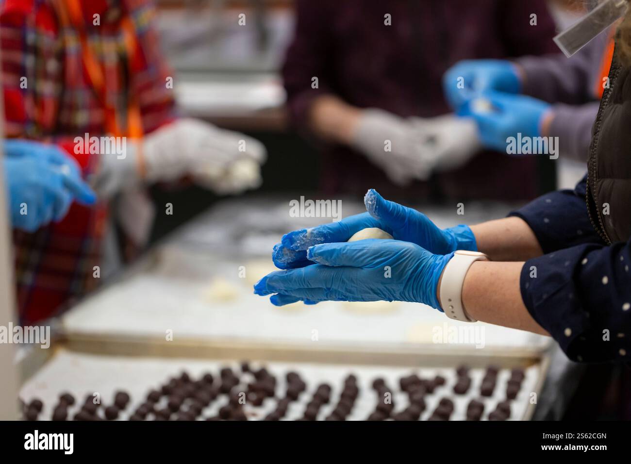 Volunteers prepare mochi at the Mochi Tsuki festival on Bainbridge ...