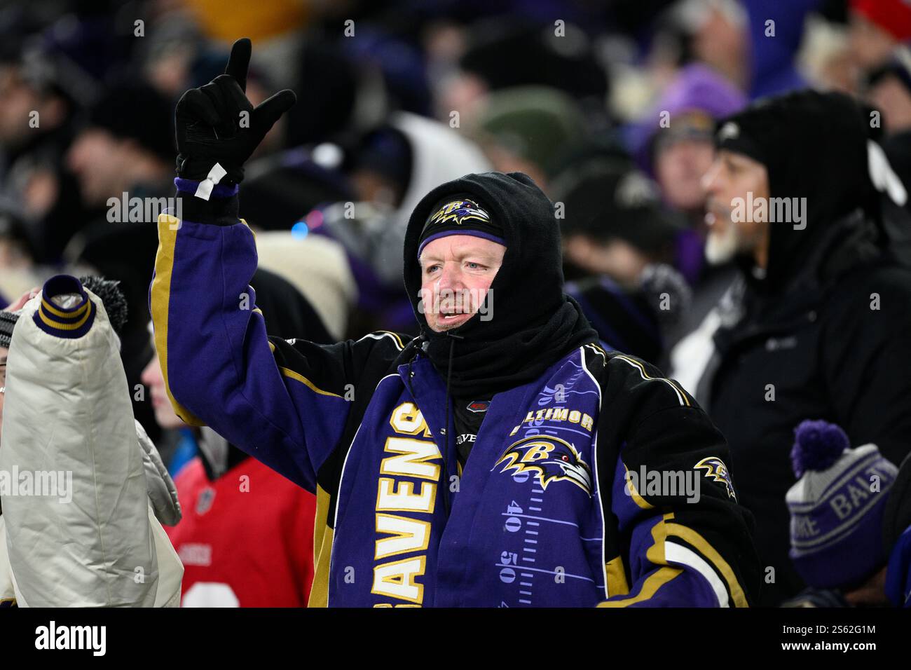 A spectator watches during the second half of an NFL football wild card ...