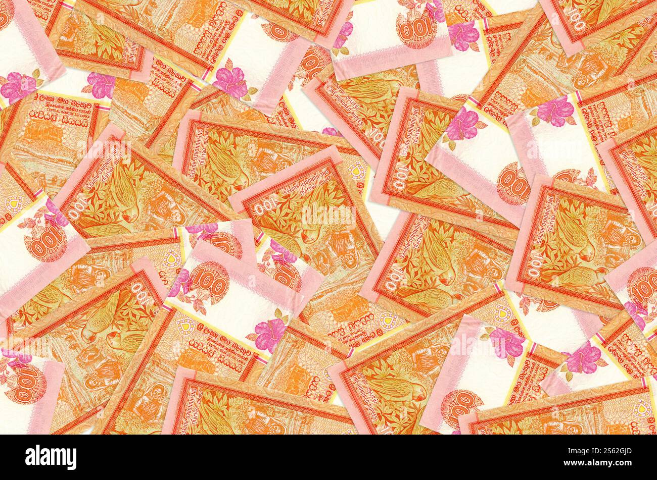 100 Sri Lankan rupees bills lies in big pile. Rich life conceptual ...