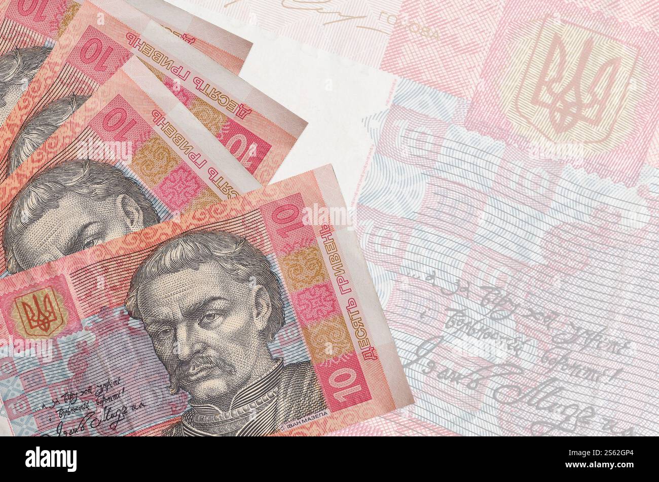 10 Ukrainian hryvnias bills lies in stack on background of big semi ...