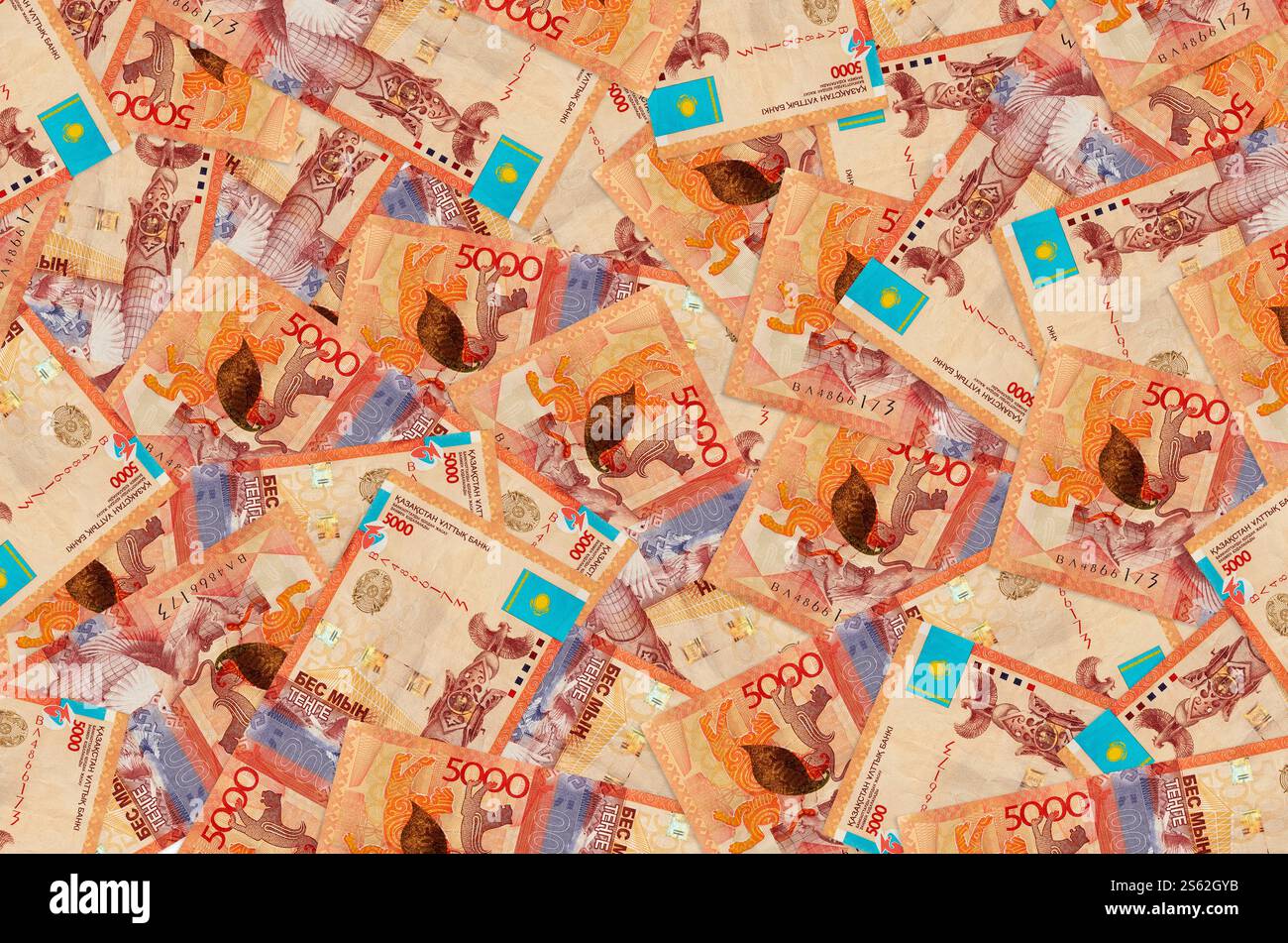 5000 Kazakhstani tenge bills lies in big pile. Rich life conceptual ...