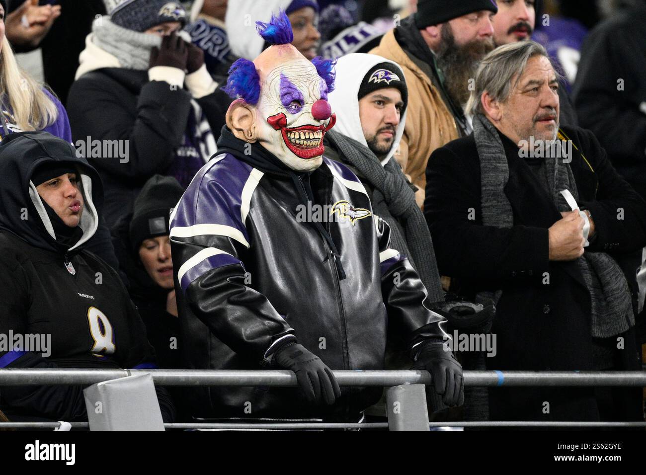 A spectator watches during the second half of an NFL football wild card ...