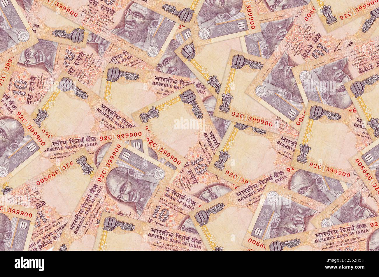 10 Indian rupees bills lies in big pile. Rich life conceptual ... 10 Indian rupees bills lies in big pile. Rich life conceptual ...