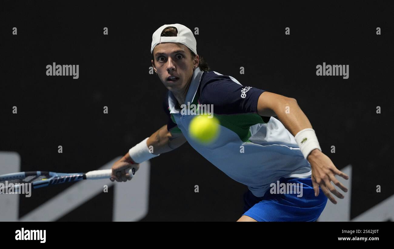 Arthur Cazaux of France plays a forehand return to Jacob Fearnley of ...