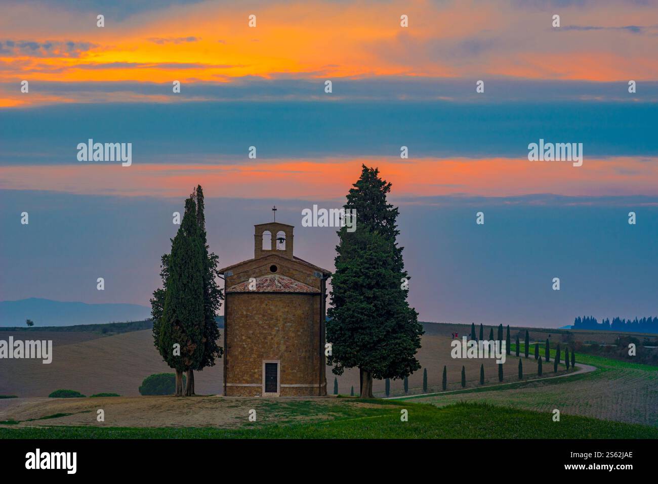 the backside of Vitaleta chapel at sunset in the countryside of Val d ...
