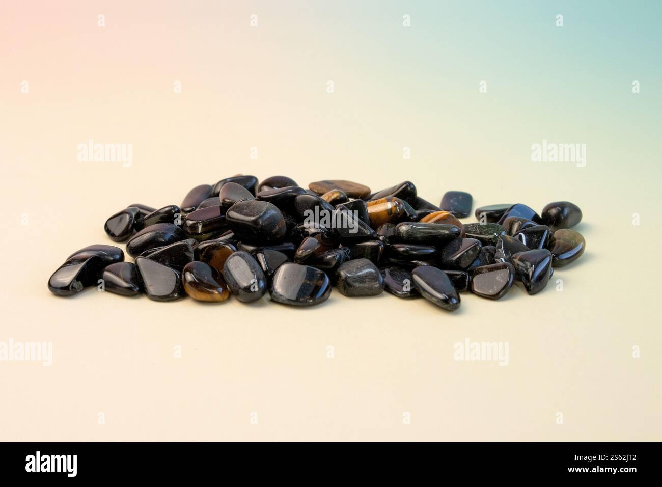 macro shooting of natural mineral stone - tumbled hawks eye gemstone ...