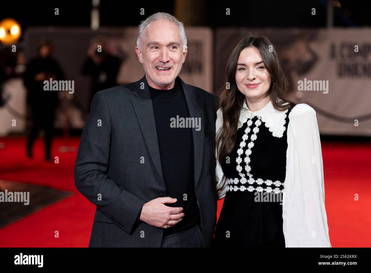 Tony Ferrino, left, and Liv Purvis pose for photographers upon arrival ...