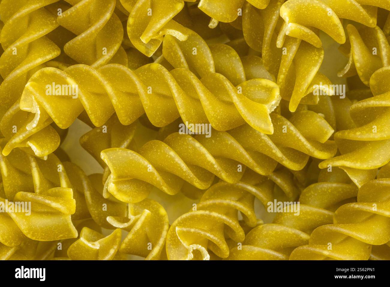 raw pasta, fusilli with split peas, close-up Stock Photo - Alamy