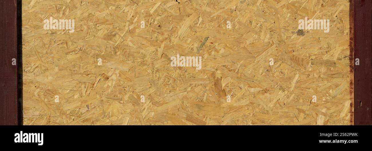 OSB boards are made of brown wood chips sanded into a wooden background ...