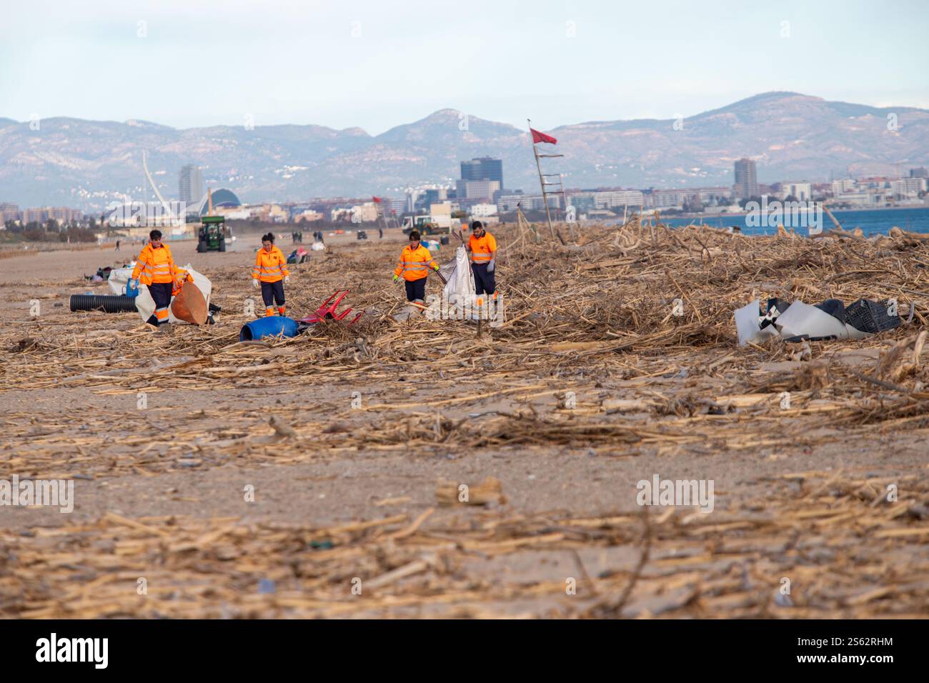 Workers are carrying out cleaning tasks on the beach Stock Photo - Alamy