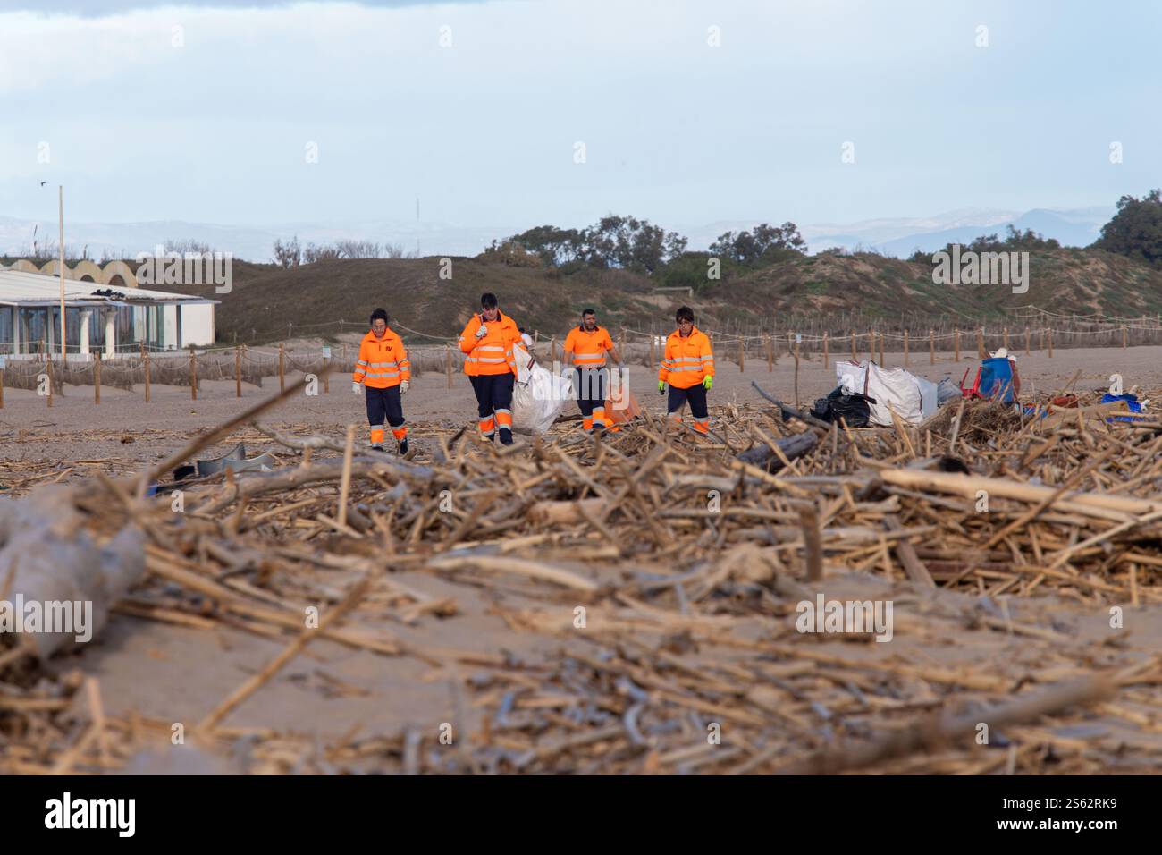 Workers are carrying out cleaning tasks on the beach Stock Photo - Alamy