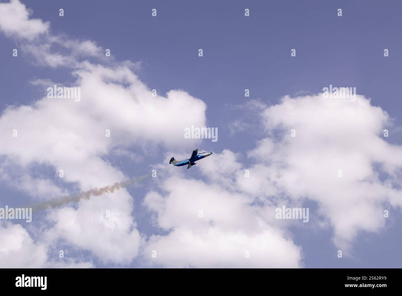 Stunt Aero L-29 Delfín jet plane flying in clouds on airshow Stock ...