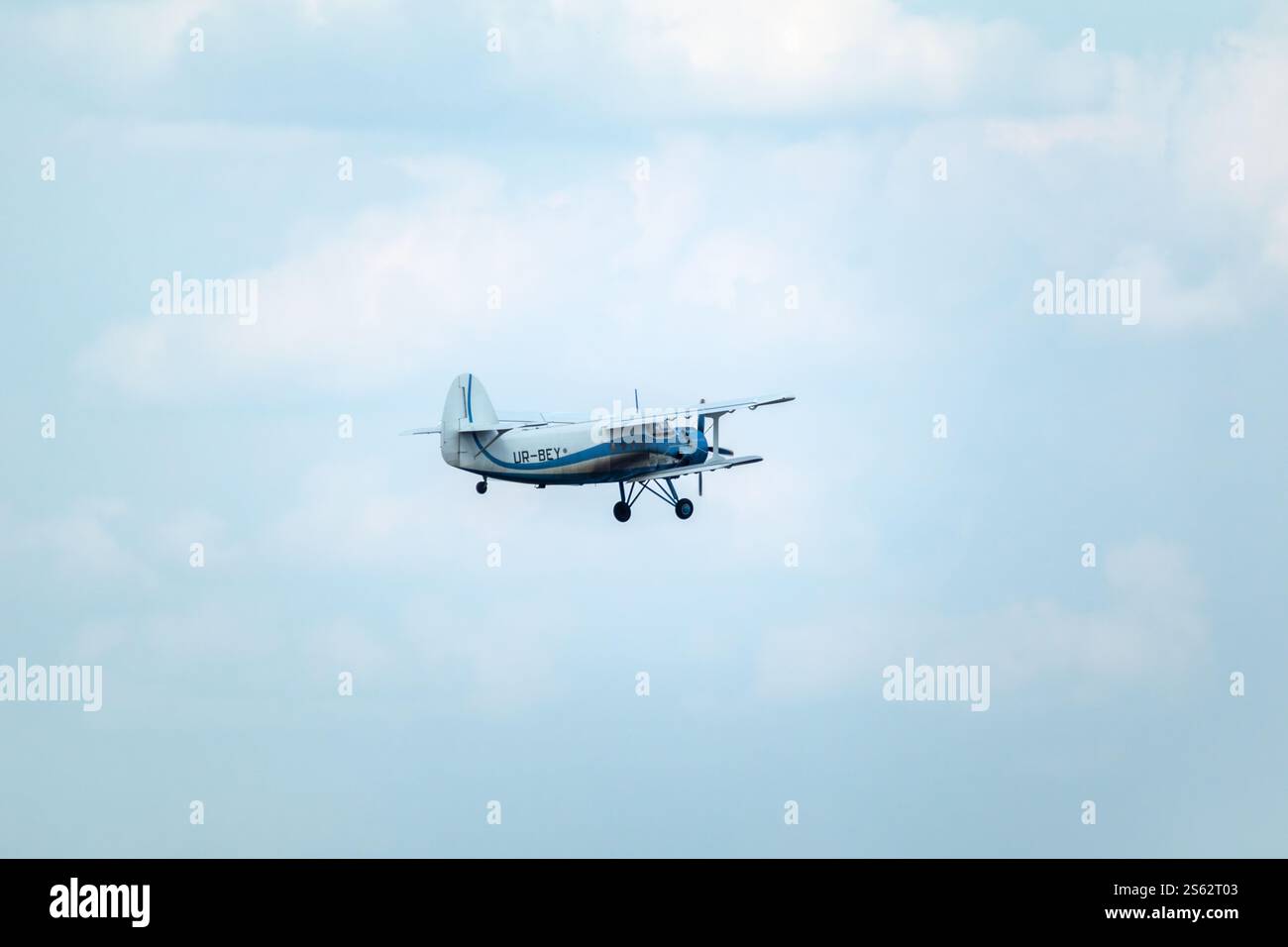 Antonov An-2 single-engine biplane passenger aircraft flying in blue ...