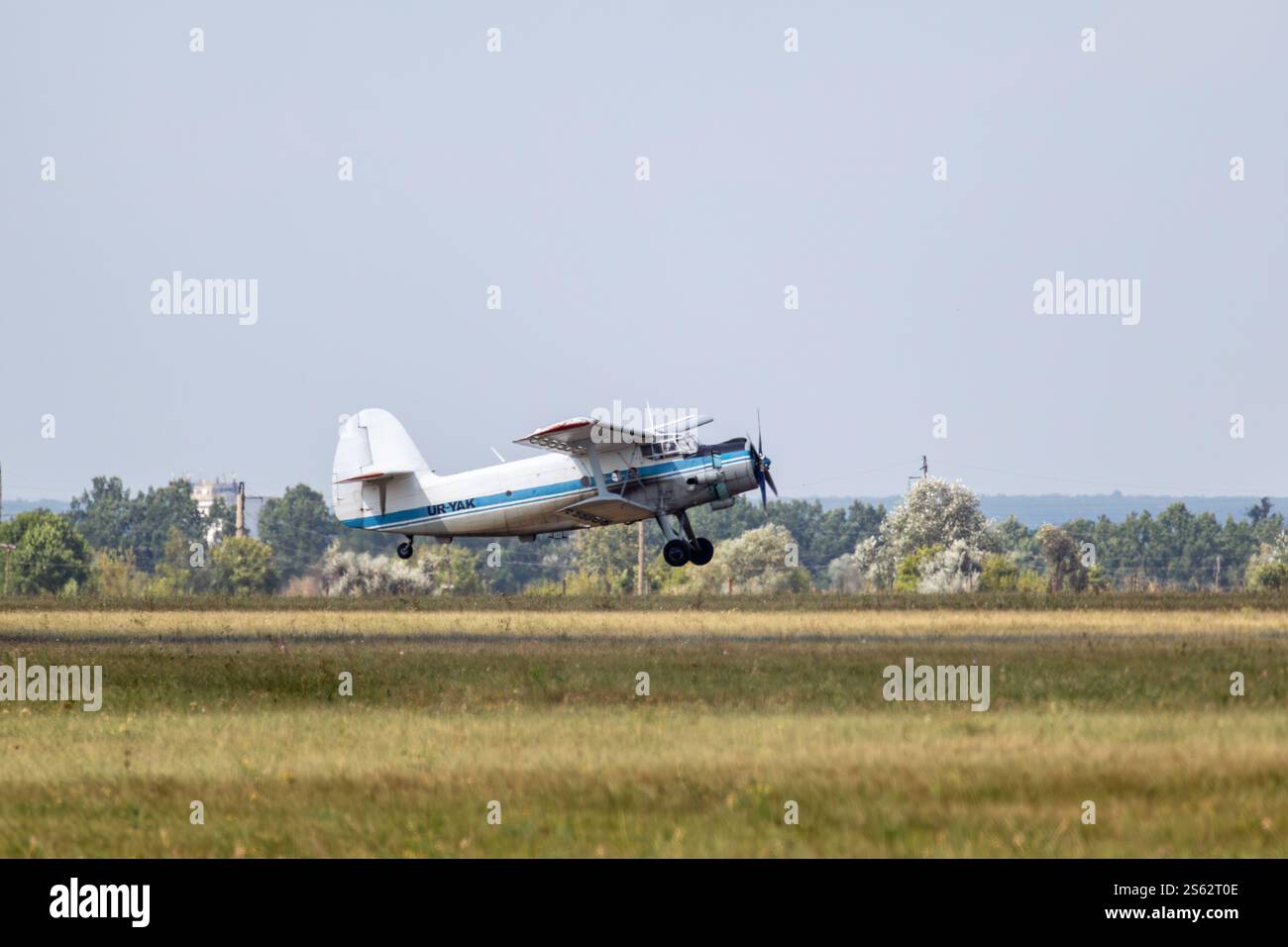 Classic Antonov An-2 biplane passenger aircraft take-off on airshow ...