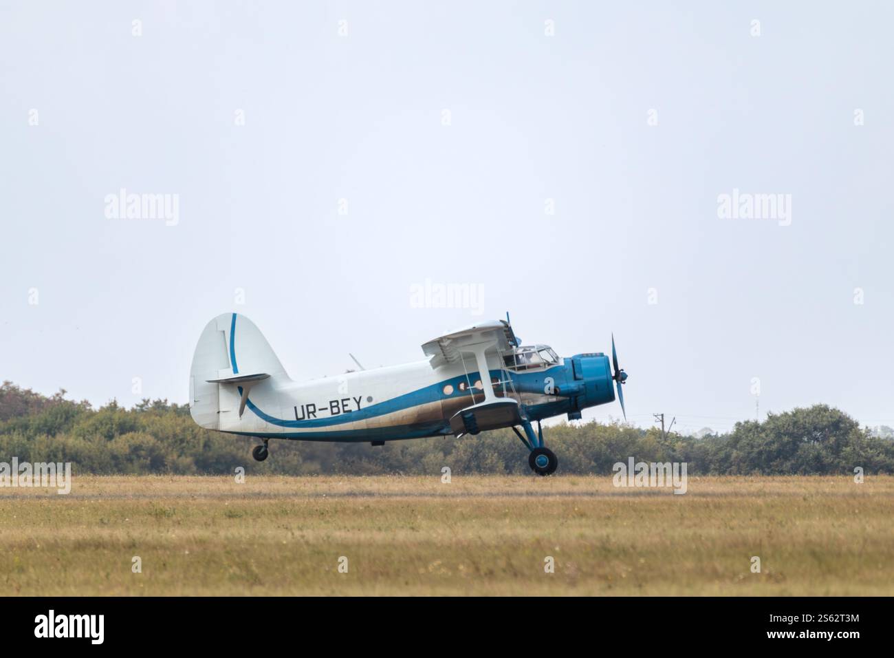Antonov An-2 biplane passenger aircraft take-off on airshow field on ...